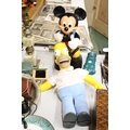 A MIXKEY MOUSE TELEPHONE PLUS A LARGE HOMER SIMPSON