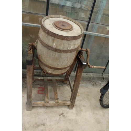 A VINTAGE WOODEN BUTTER CHURN WITH STAND AND PLAQUE BEARING THE LABEL ...