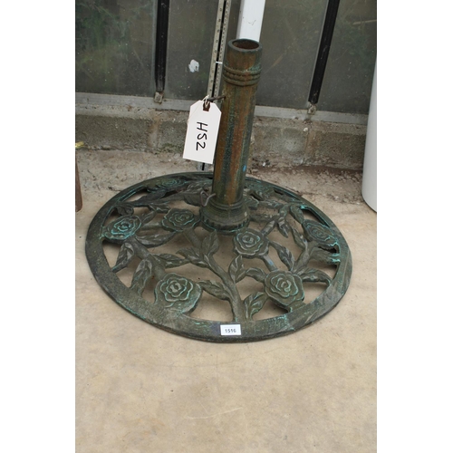 A LARGE FLORAL DESIGN CAST IRON PARASOL BASE
