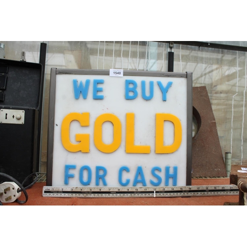 AN ILLUMINATED 'WE BUY GOLD FOR CASH' SIGN