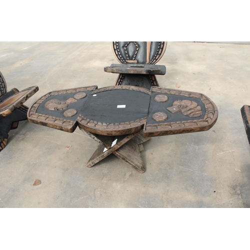 A SET OF FOUR AFRICAN HARDWOOD BIRTHING TYPE CHAIRS AND A SMALL ...