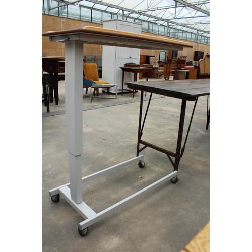 AN N.R.S. HEALTHCARE EASYLIFT OVER BED TABLE