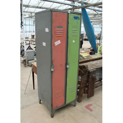 A TALL METAL DOUBLE LOCKER UNIT