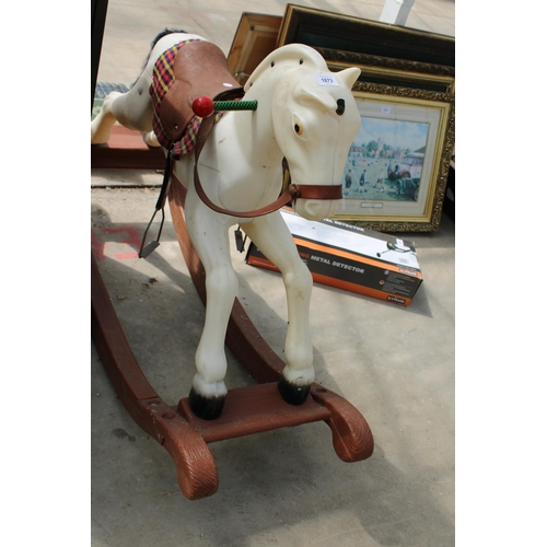 A VINTAGE PLASTIC ROCKING HORSE
