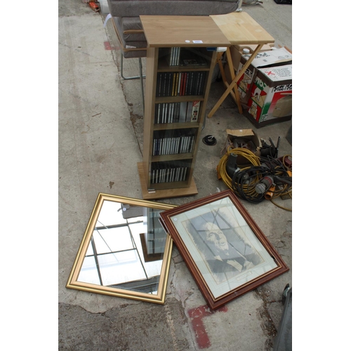 A LARGE ASSORTMENT OF CDS, A FRAMED PRINT AND A WALL MIRROR