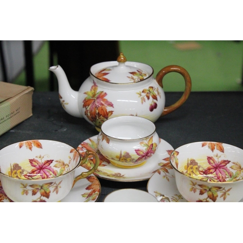 A VINTAGE AYNSLEY TEAPOT WITH TWO CUPS AND SAUCERS A PLATE AND SUGAR ...