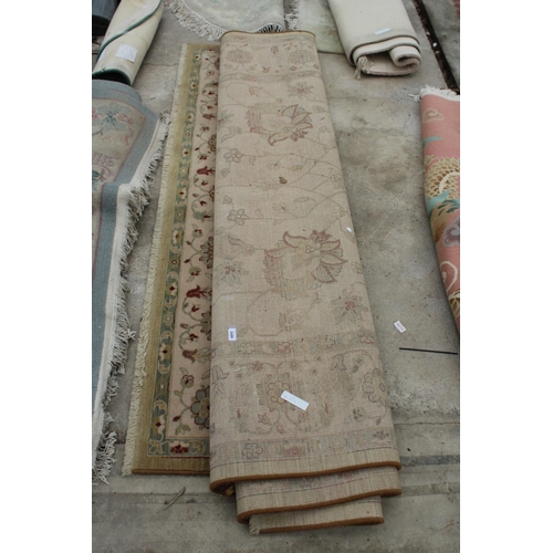 A CREAM PATTERNED FRINGED RUG