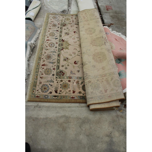 A CREAM PATTERNED FRINGED RUG
