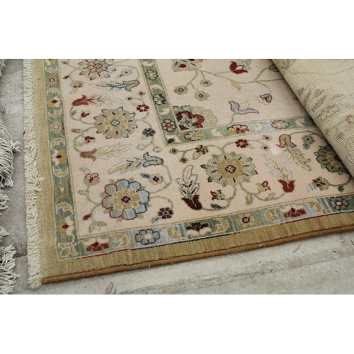 A CREAM PATTERNED FRINGED RUG