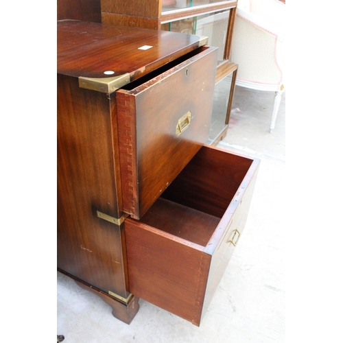A MAHOGANY TWO DRAWER FILING CABINET WITH CAMPAIGN STYLE HANDLES AND ...