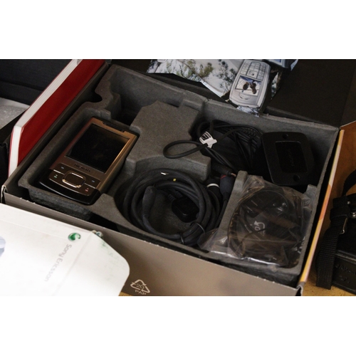 A COLLECTION OF OLD MOBILE PHONES IN BOXES TO INCLUDE A BLACKBERRY ...