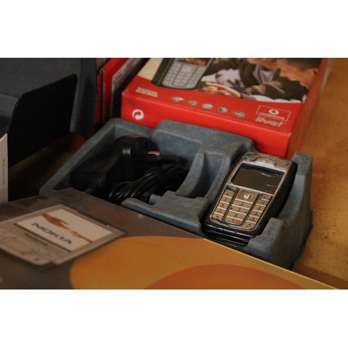 A COLLECTION OF OLD MOBILE PHONES IN BOXES TO INCLUDE A BLACKBERRY ...