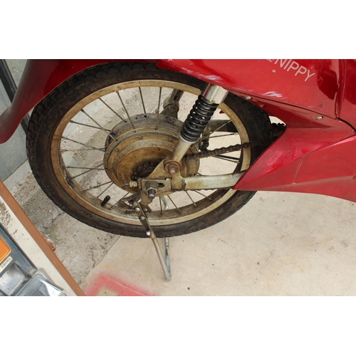 A THOMPSON ELECTRIC NIPPY BIKE COMPLETE WITH KEY