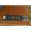 A SMALL CAST ALLOY LEYLAND MOTORS SIGN