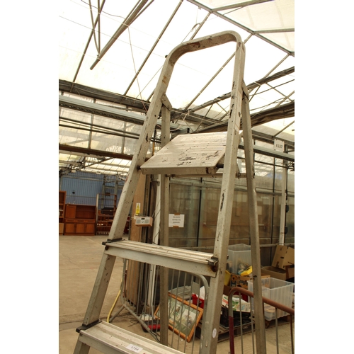 A SEVEN RUNG ALUMINIUM STEP LADDER