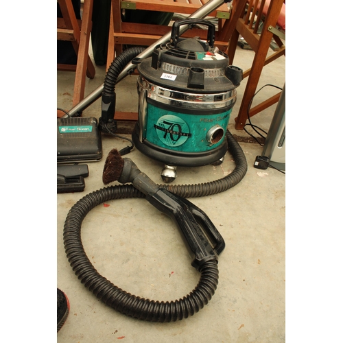 A FILTER QUEEN VACUUM CLEANER WITH ATTATCHMENTS