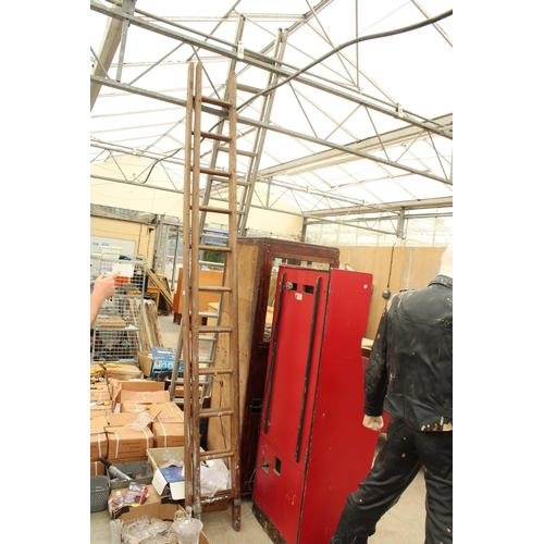 A VINTAGE 22 RUNG WOODEN EXTENDABLE TWO SECTION LADDER