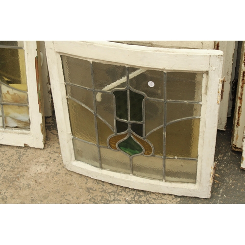 A LARGE ASSORTMENT OF WOODEN FRAMED STAIN GLASS WINDOWS