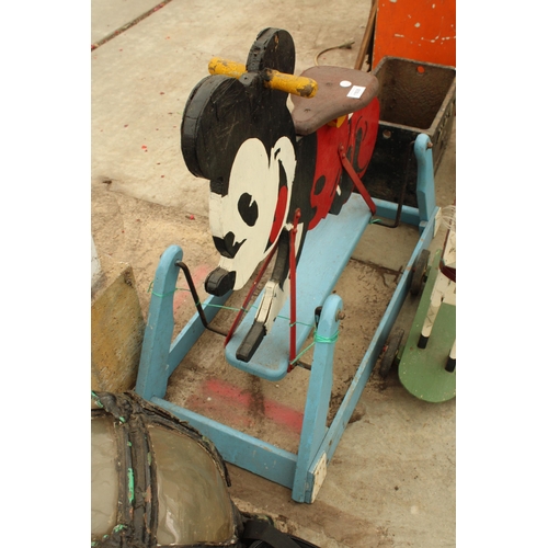 A VINTAGE WOODEN MICKEY MOUSE ROCKING HORSE AND A FURTHER PUSH ALONG HORSE