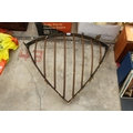A VINTAGE CAST IRON CORNER HAYRACK