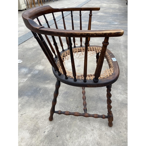 A MID 20TH CENTURY TUB CHAIR WITH SPINDLE BACK AND BARLEY TWIST LEGS ...