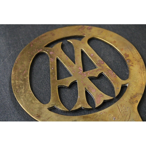 A STENSON COOKE LARGE BRASS AA BADGE