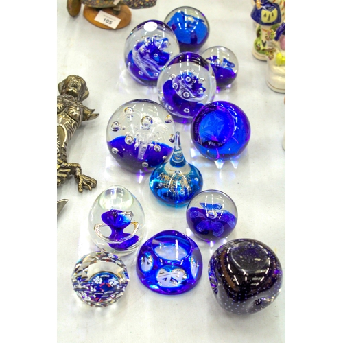 A COLLECTION OF TWELVE BLUE THEMED GLASS PAPERWEIGHTS