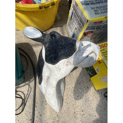 A DECORATIVE FIBRE GLASS HOLSTEIN COW HEAD