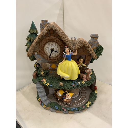A LARGE DISNEY MANTLE CLOCK, SNOW WHITE AND MINING DWARVES