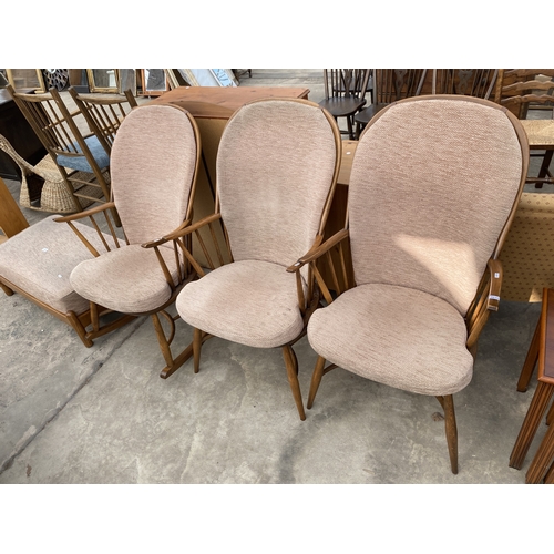 AN ERCOL WINDSOR STYLE ARMCHAIR WITH CRINOLINE BOW