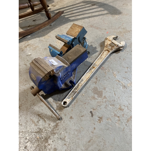TWO BENCH VICES TO INCLUDE A RECORD AND A LARGE ADJUSTABLE SPANNER