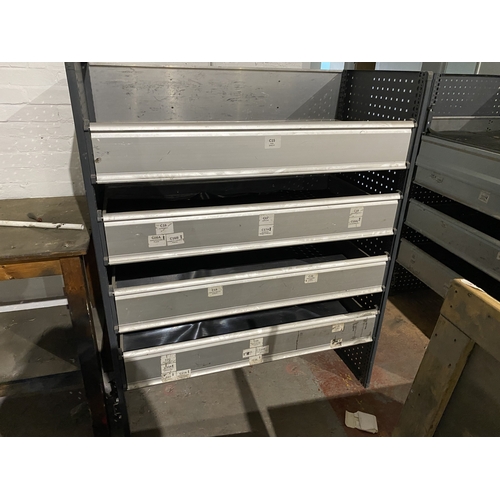 A PAIR OF METAL RACKS WITH DROP SHELVES