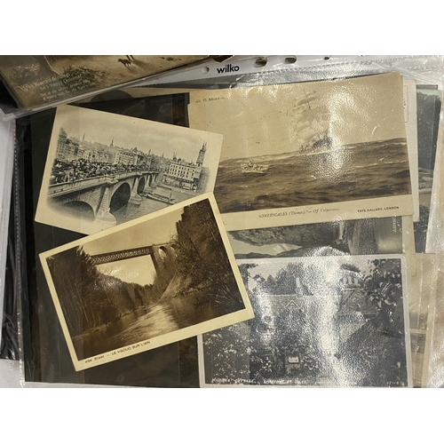 TWO ALBUMS CONTAINING VINTAGE POSTCARDS AND PHOTOGRAPHS