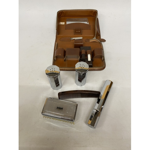 A VINTAGE GENTLEMEN'S GROOMING KIT IN A LEATHER CASE