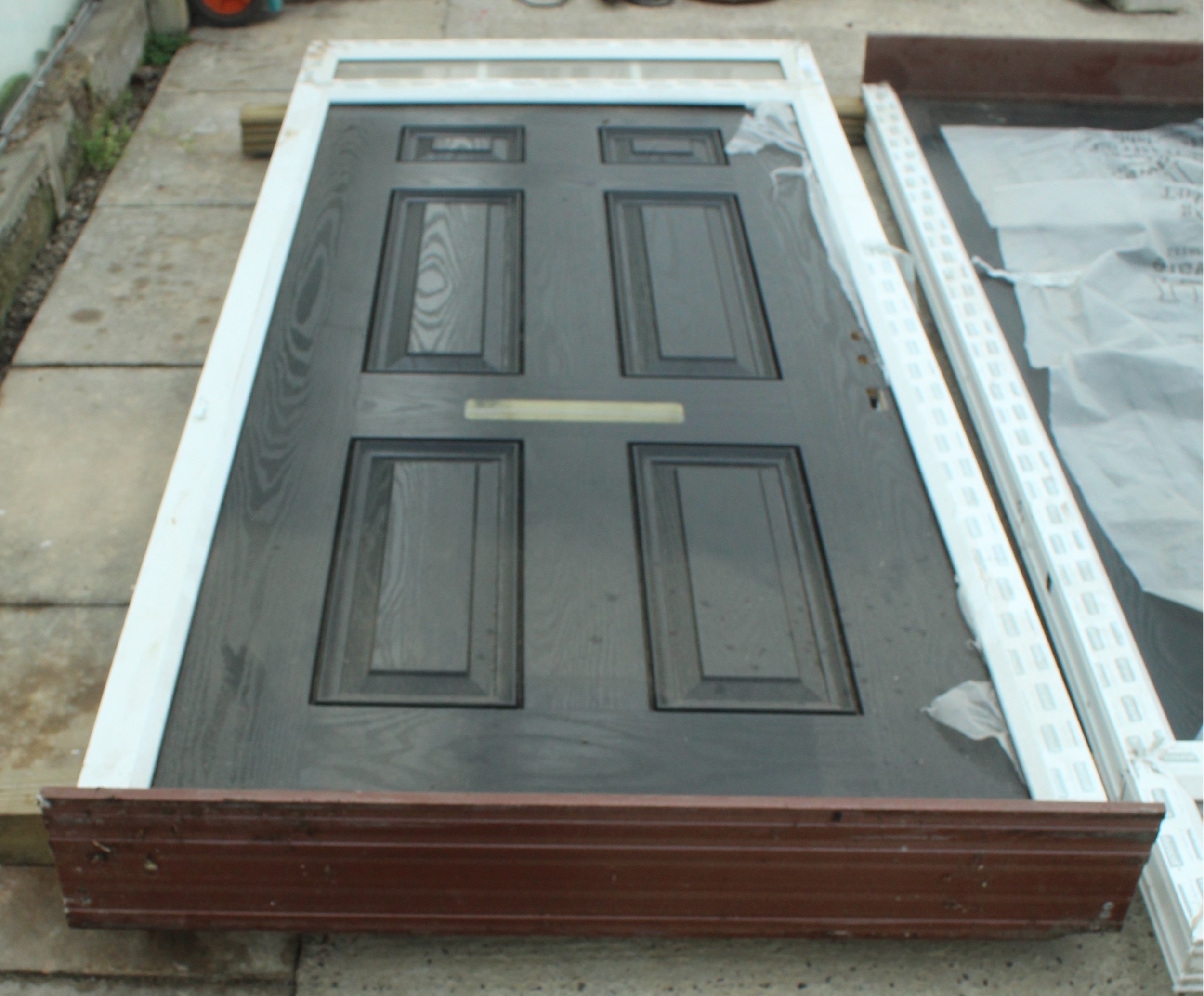 A NEW uPVC FRONT DOOR 1 M X 7 FT 7 APPROX. NO VAT