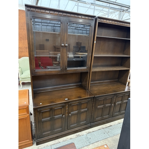 AN ERCOL ELM TWO DOOR BOOKCASE ON BASE, 38.5" WIDE