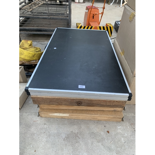 THREE WOODEN FOLDING PASTING TABLES AND A FURTHER FOLDING TABLE