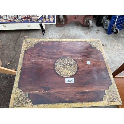 AN ORIENTAL HARDWOOD OPIUM STYLE TABLE WITH APPLIED BRASS DECOREATION ...