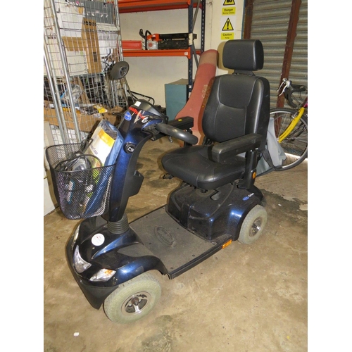 AN INVACARE MOBILITY SCOOTER WITH CHARGER