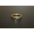 AN 18CT GOLD ILLUSION SET STONES RING WITH