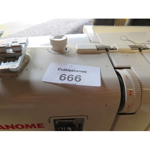 A JANOME COVER PRO 2000CPX OVERLOCKER SEWING MACHINE