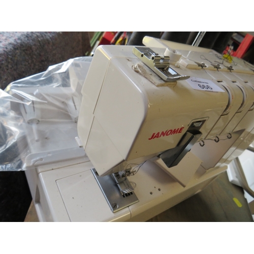A JANOME COVER PRO 2000CPX OVERLOCKER SEWING MACHINE