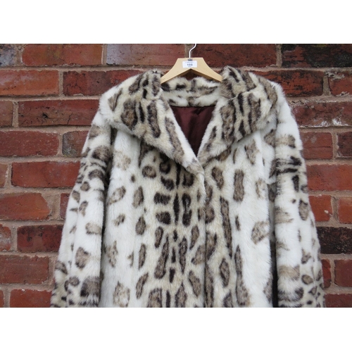 TWO VINTAGE LADIES FAUX FUR COATS, comprising an animal print Astraka ...