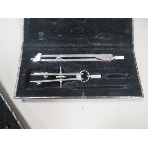 Four cased technical drawing sets