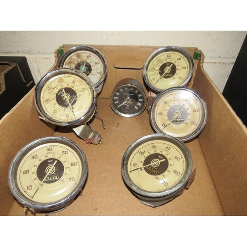 A tray of seven vintage car speedometers to include Cortina and six Smiths
