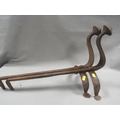 A pair of vintage cast iron fire dogs
