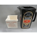 A vintage Tullamore Dew whiskey square jug together with a Bushmills ...