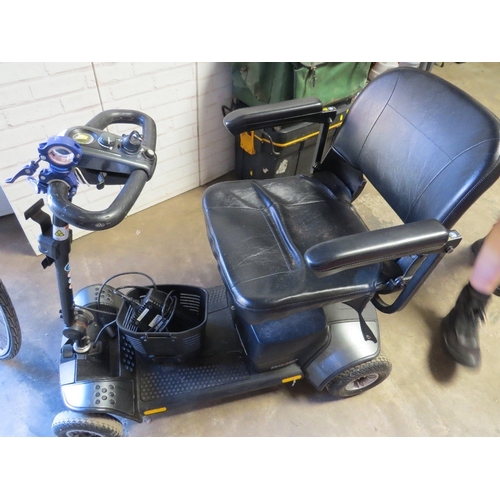 A Pride GoGo mobility scooter with key / charger