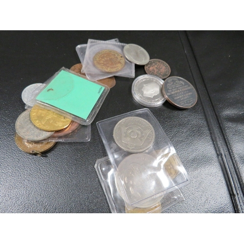 A bag of coins, tokens and medals