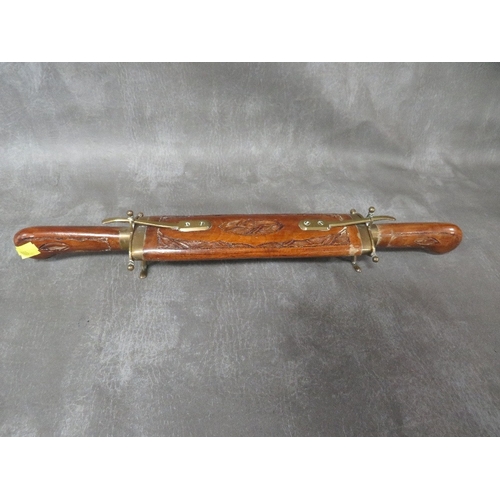 A Middle Eastern style carving set in decorative wooden stand